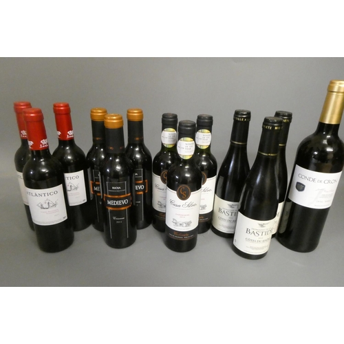 Twelve half and one full bottle of European red wine, comprising three ...