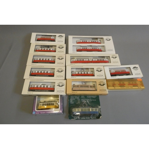 Thirteen static plastic HO scale European model trams, all items boxed ...