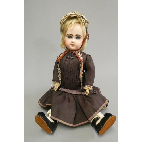 A Tete Jumeau bisque socket head doll with blue glass fixed eyes ...