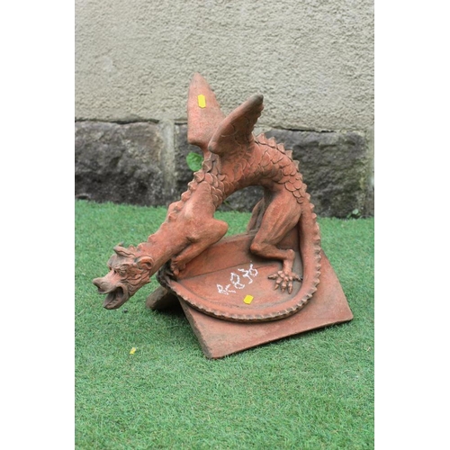 A TERRACOTTA DRAGON ROOF RIDGE FINIAL, mounted on a triangular base, 17 ...