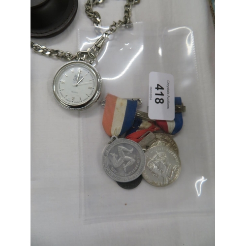 A collection of Manx medallions, coin and watch