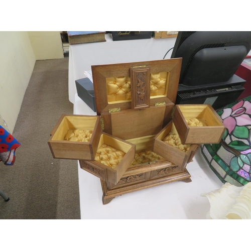 Well carved black forest jewel casket with five fold out sections with ...