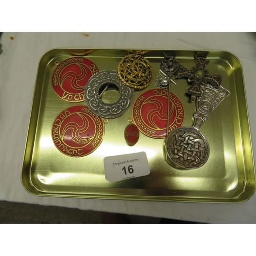 A collection of Manx and Gaelic jewellery and badges