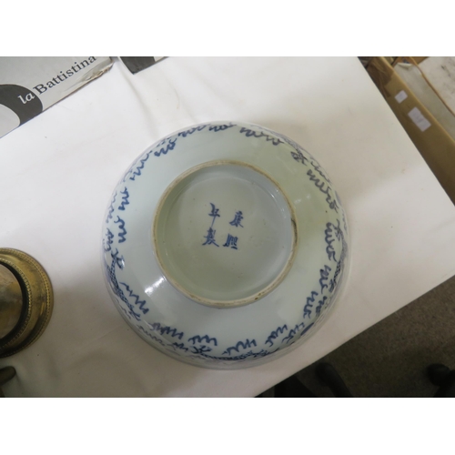Chinese blue and white chow bowl decorated with dragons chasing a ...