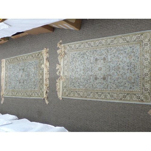 Pair of small blue wool carpets
