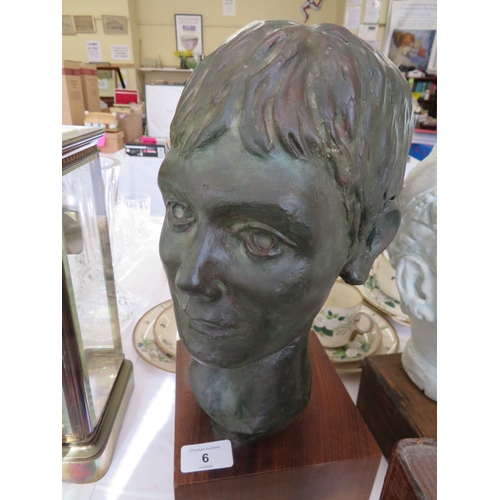 Composite head of a child on a hardwood stand, height 14ins