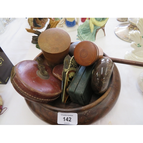 A collection of knick-knacks in a wooden bowl together with fine lace