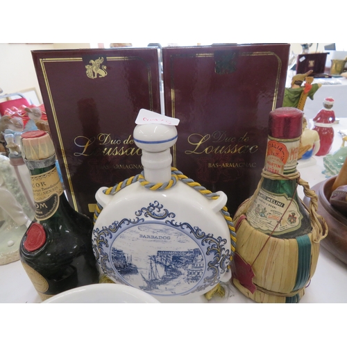 Two bottles of Duc de Loussac armagnac plus three other bottles