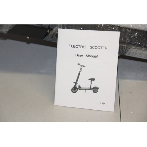 As new (still in its wrapping and shipping box) Electric scooter
