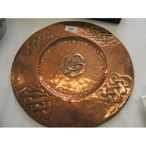 A copper celtic design dish