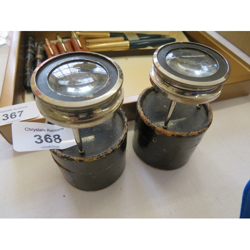 Two magnifying glasses with boxes