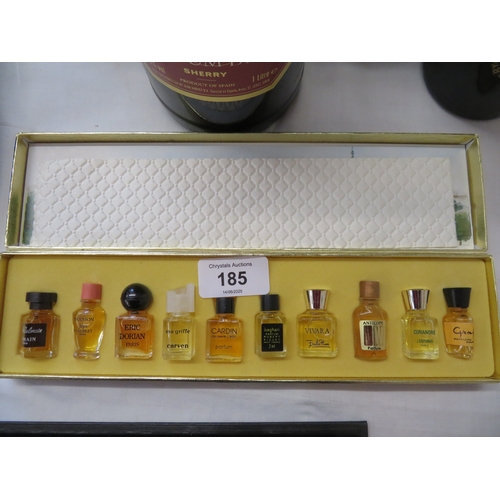 Ten miniature bottles of Parisian perfume, boxed