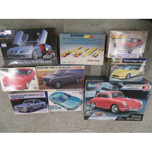 Nine various unmade models of cars, 1:16 scale and smaller, all boxed ...