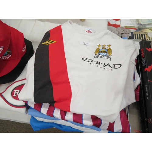 Seven official Manchester City football shirts