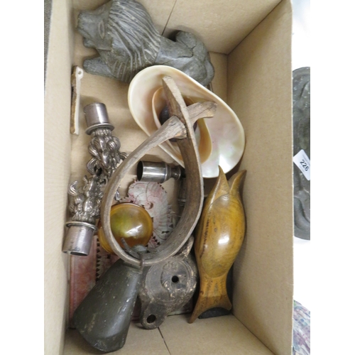 A collection of Roman oil lamp, snuff box, bell, candlestick tops ...