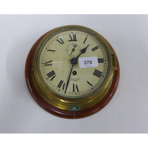 Smiths Empire ships style brass wall clock, 20cm, on a wooden plaque
