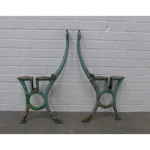 Pair of cast iron bench ends, painted green. 78 x 40cm. (2)