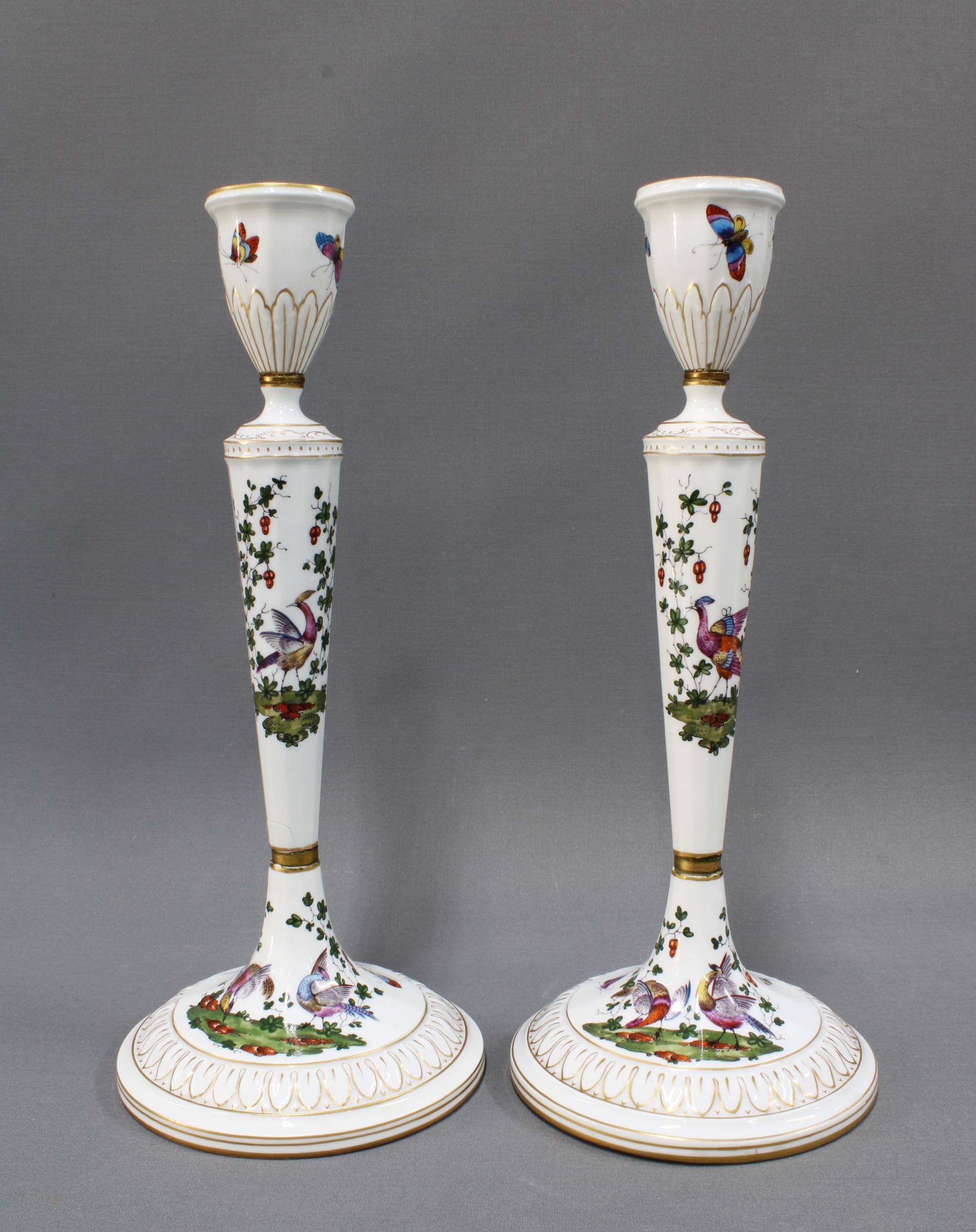 A pair of porcelain candlesticks, handpainted with fancy bird patterns ...