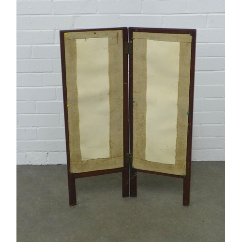 A small mahogany two fold embroidered screen, 59 x 82cm.