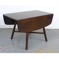 A vintage dark elm Ercol table, 125 x 73 x 113cm.