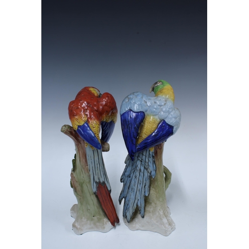 Two Sitzendorf parrots, taller 31cm, together with a blue and white ...