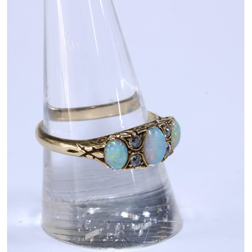 An early 20th century 18ct gold opal and diamond seven stone ring ...