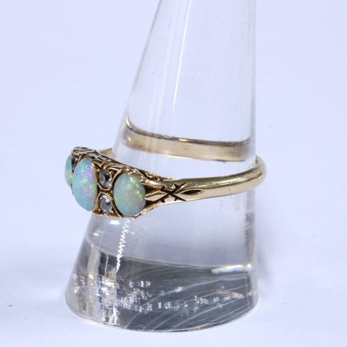 An early 20th century 18ct gold opal and diamond seven stone ring ...
