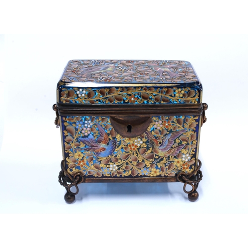 An enamelled blue glass casket painted with birds and foliage, in the ...