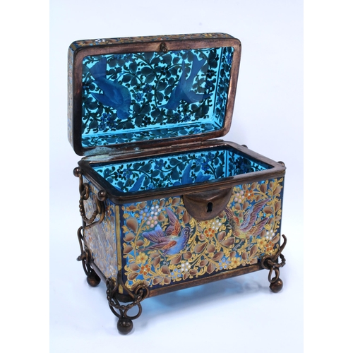 An enamelled blue glass casket painted with birds and foliage, in the ...