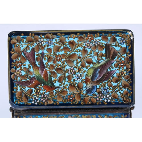 An enamelled blue glass casket painted with birds and foliage, in the ...