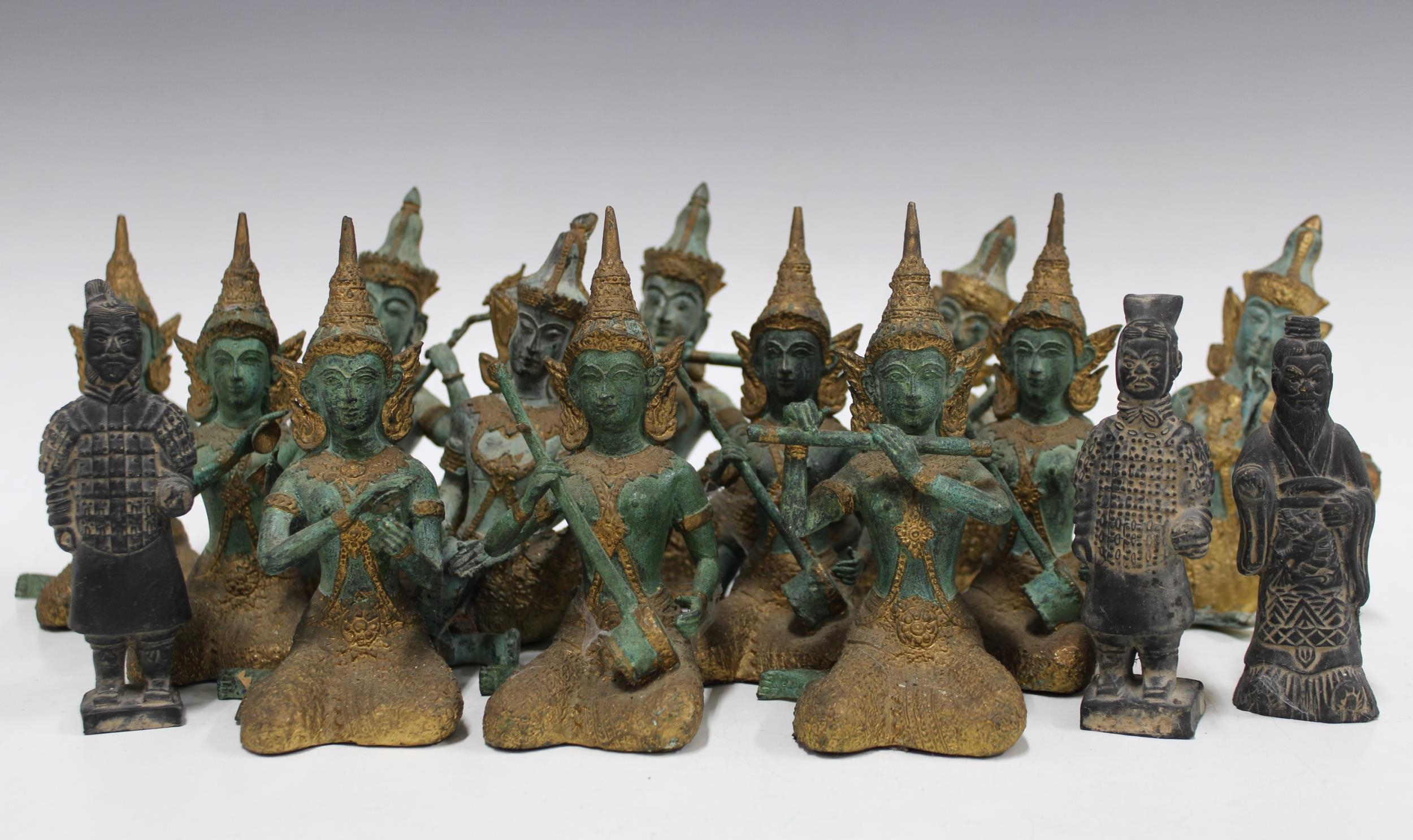 Collection of Thai/ Burmese metal musician figures, together with three ...