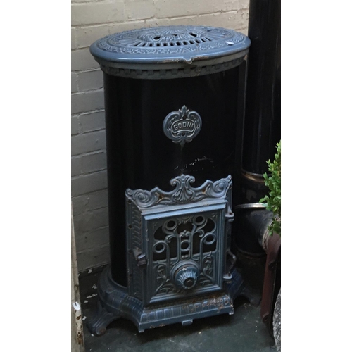 A French Godin enamelled stove, approx. 94cmH, with flue