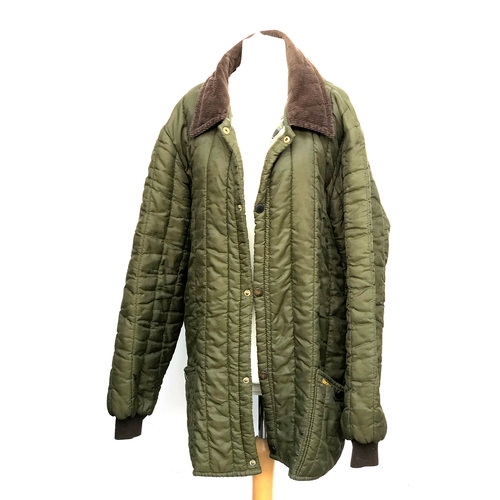 A Barbour quilted jacket with brown corduroy collar, a Barbour check lining