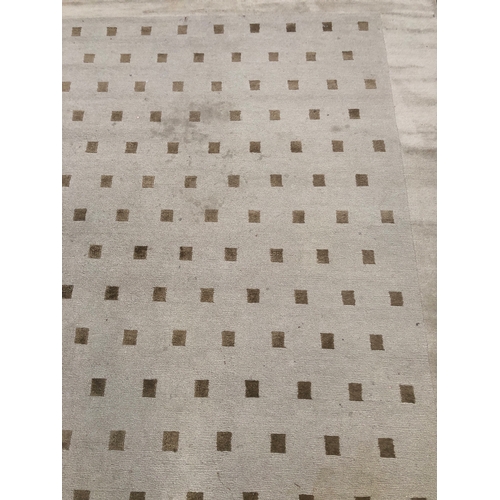A very large wool rug by The Rug Company, 525x340