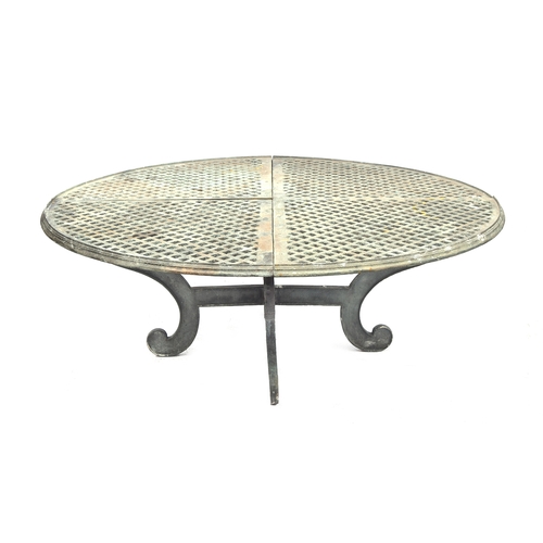 A substantial bronze garden table, four part trellis top, raised on ...