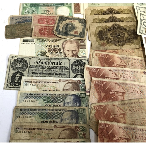 A quantity of banknotes to include a George V ten shillings treasury ...