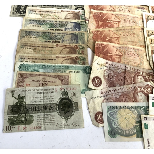 A quantity of banknotes to include a George V ten shillings treasury ...