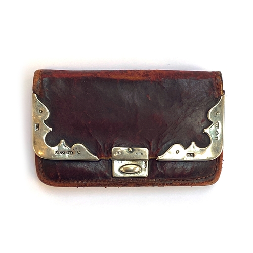 An Edwardian silver mounted red leather purse, import marks for ...