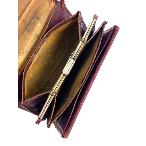 An Edwardian silver mounted red leather purse, import marks for ...