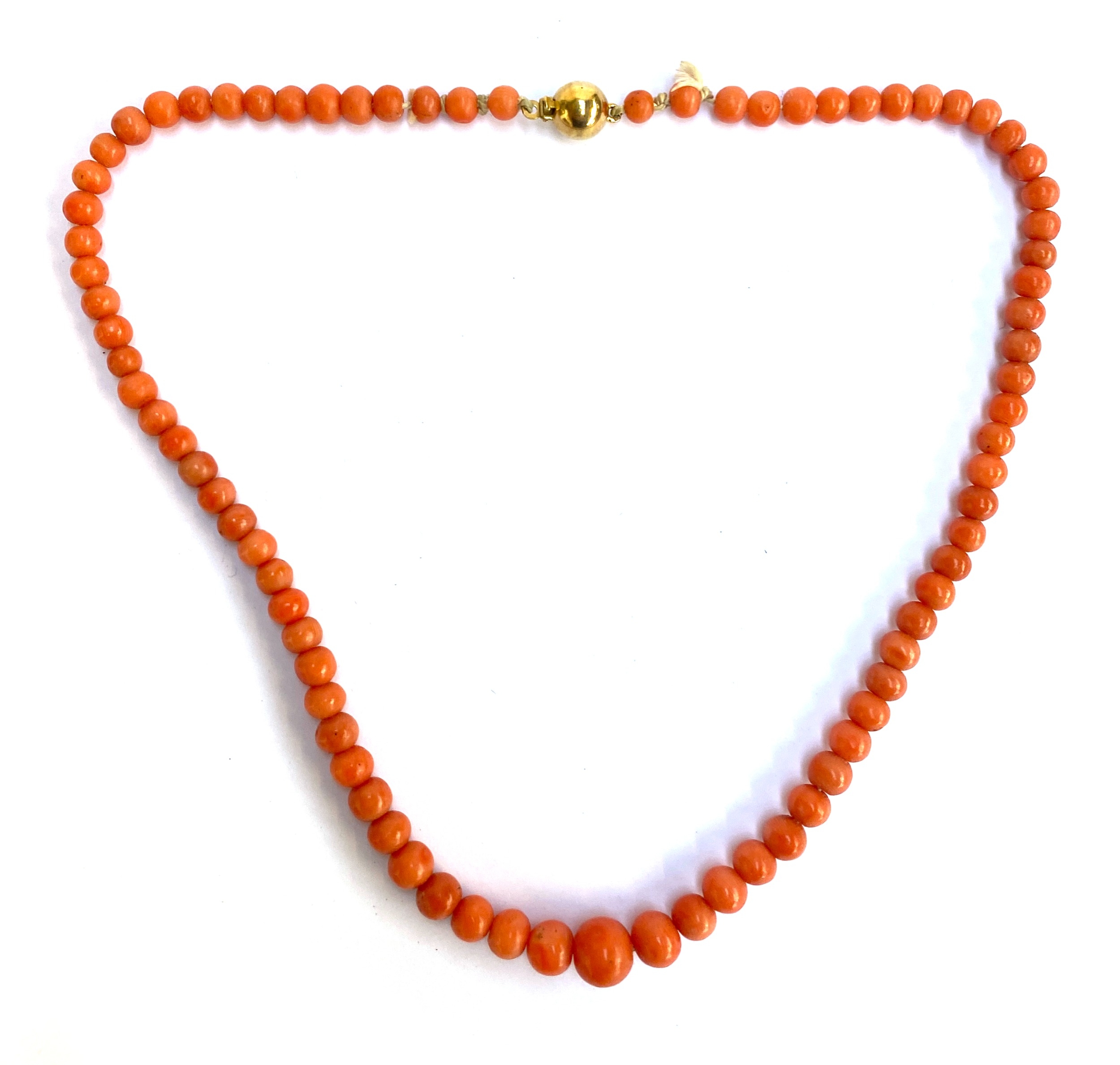 A 20th century red coral bead necklace, the beads graduating from 4mm ...