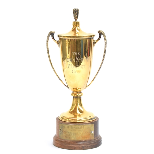 A silver gilt twin handled trophy cup and cover by C J Vander Ltd ...
