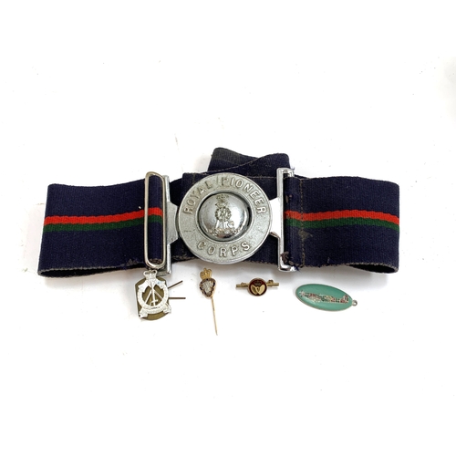A Royal Pioneer Corps belt and cap badge, together with a Royal British ...