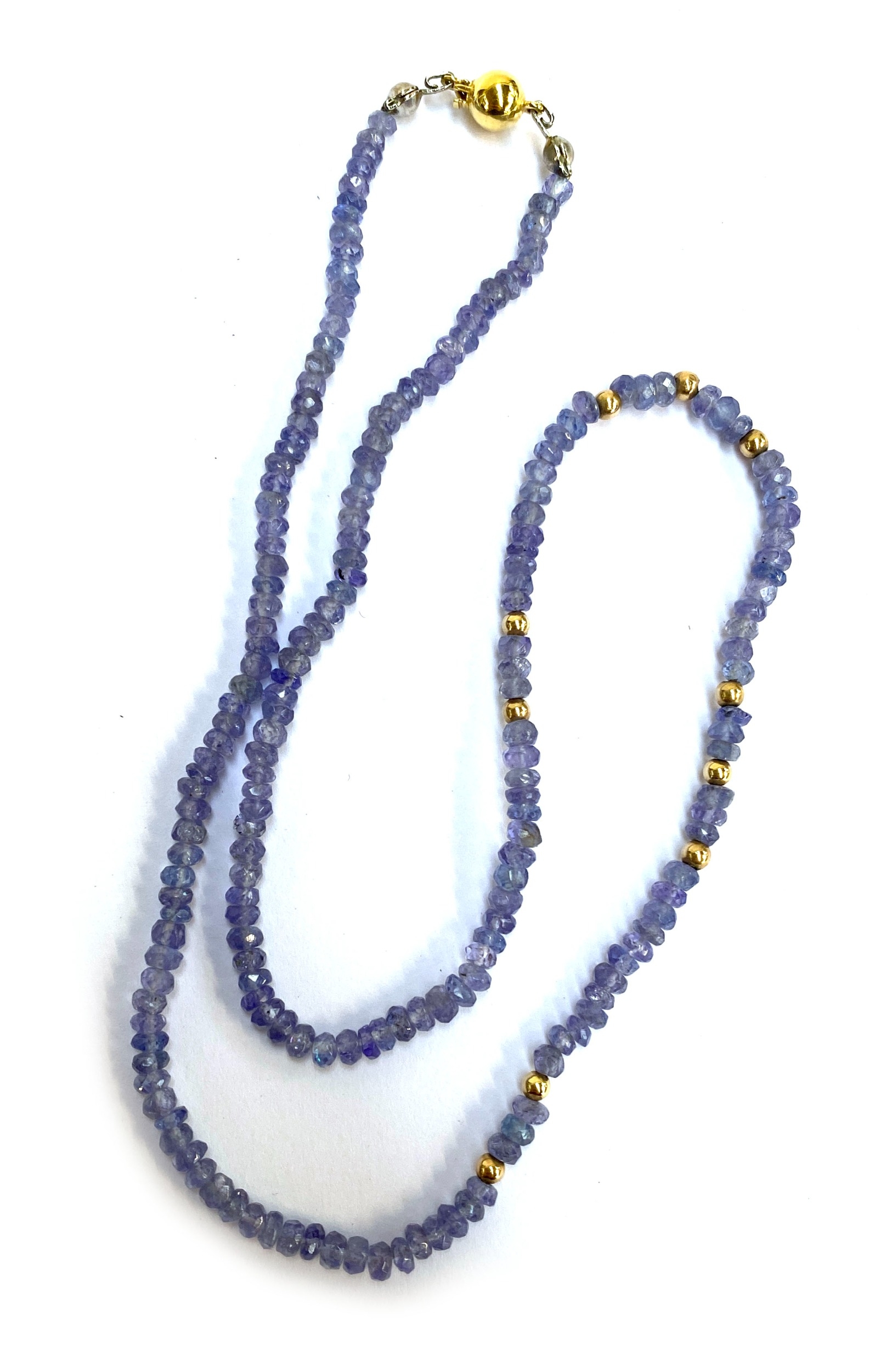 A faceted iolite and gold bead necklace fastening with a 9ct gold clasp ...