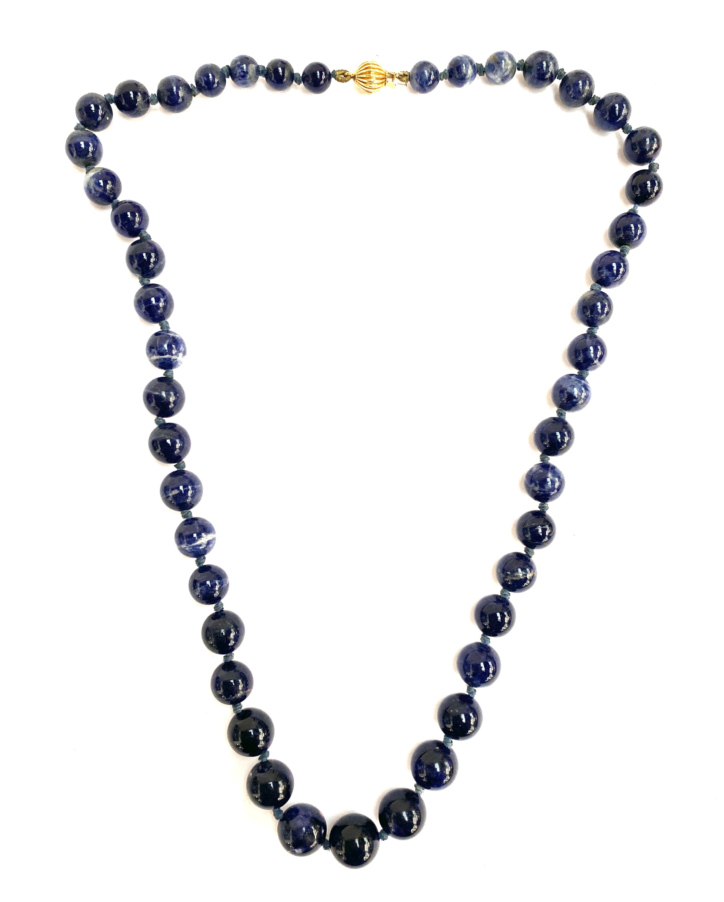 A sodalite bead necklace fastening with a 9ct gold clasp, 54cmL unclasped