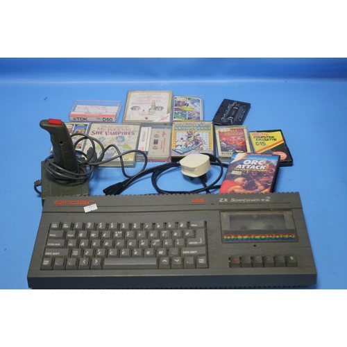 A SINCLAIR ZX SPECTRUM +2 WITH WIRES AND ACCESSORIES, together with a ...