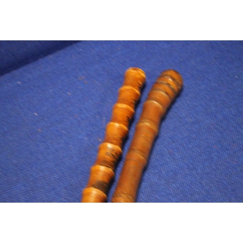 TWO ANTIQUE JAPANESE WALKING CANES WITH TYPICAL DECORATION