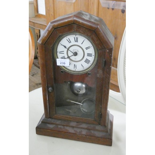 A late 19th century American bracket clock in mahogany case with white ...