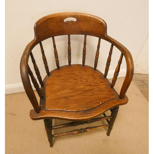 An oak spindle back office elbow chair