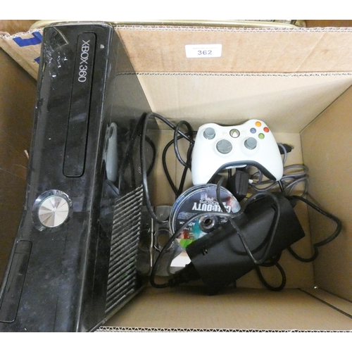 A black X-Box 360 with games, controllers etc