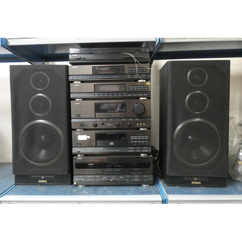A six tier Aiwa music system to include cassette player, CD player ...